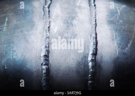 Two vertical welding seams on a steel pipe, close-up Stock Photo - Alamy