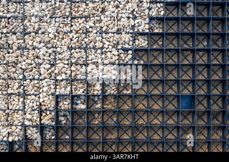 Installation of gravel grid on a driveway to stop movement of stones ...