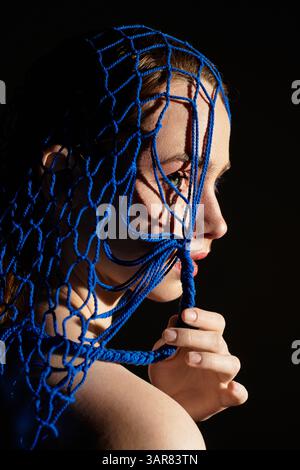 Woman with a netting on her face Stock Photo - Alamy
