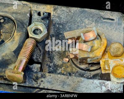 Cairo, Egypt, March 13 2025: broken battery terminal, rusty broken car ...