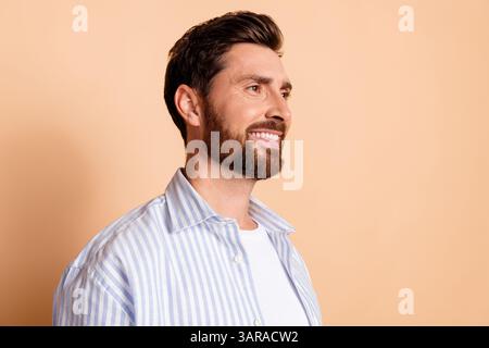 Handsome guy with stubble in striped t-shirt laughing on camera ...