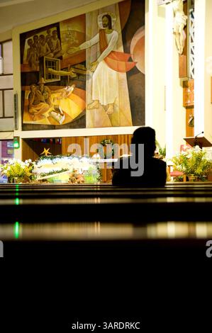 Dec 21, 2009 - Lima, Peru - A woman prays during one of two daily mass ...