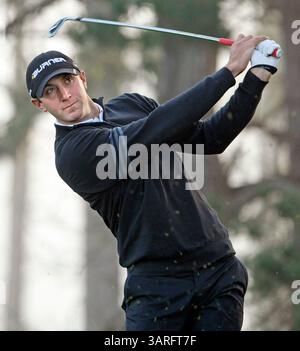 Dustin Johnson hits his tee shot on the second hole during the first ...