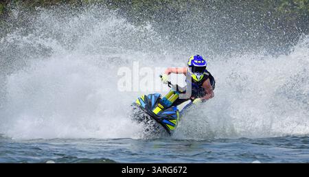 Jet Ski racer cornering at speed creating at lot of spray Stock Photo ...