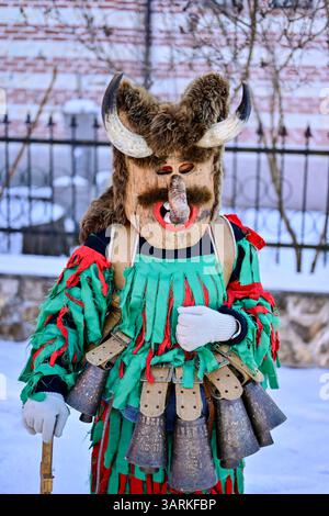 This striking portrait captures a Kuker wearing a traditional hand ...