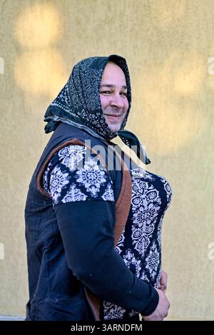 A Kukeri performer parades through Breznik dressed in traditional ...