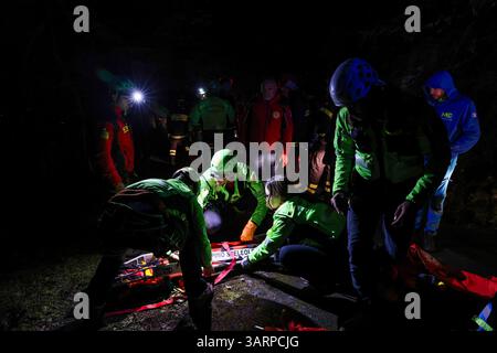Rescuers at work near the site of the Monte Faito cable car crash that ...