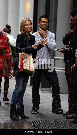 Kelly Ripa, left, and Mark Consuelos attend the ESPN Original Series premiere of "Running with ...