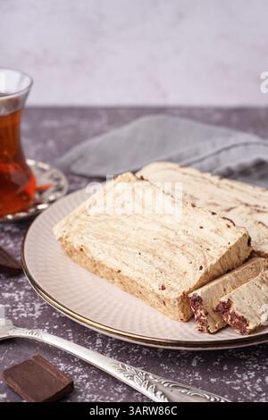 Plate with pieces of tasty marble halva on white background Stock Photo ...