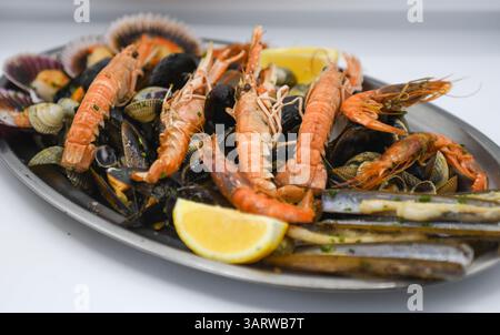 Grilled seafood platter consisting of clams, shrimp, crabs, mussels ...
