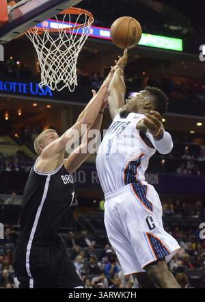 Charlotte Bobcats' Jeff Adrien (4) shoots over Atlanta Hawks' Mike ...