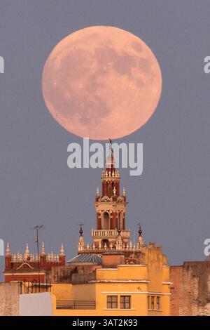 symmetrical super moon with statue Stock Photo - Alamy