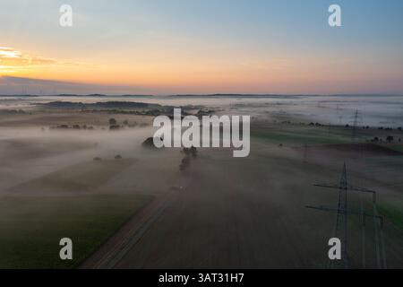 German rural scenery, drone aerial view, in the morning at golden hour ...