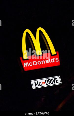 A picture of the neon sign of a McDonald's Stock Photo - Alamy