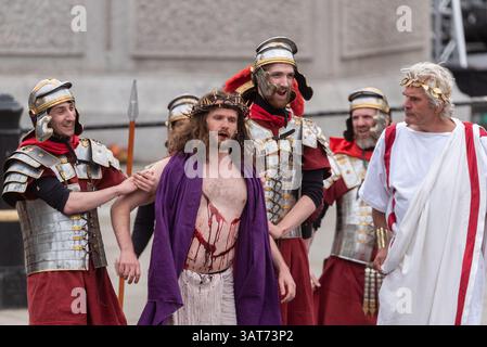 Jesus Christ, played by Peter Bergin, carrying the Crucifixion cross ...