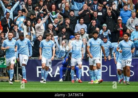 5, Jack Rudoni of Coventry City is congratulated for the goal by 23 ...