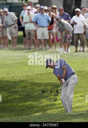 Matt Kuchar hits from the rough on the eighth hole during the first ...