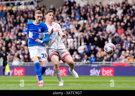 Birmingham City's Jay Stansfield (left) shoots at goal during the ...