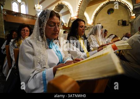 Alqosh, Iraq. 18th Apr, 2025. Clergy carrying the coffin of Christ ...