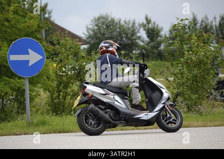 Moped riding technique training on the practice area Stock Photo - Alamy