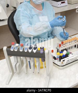 Nurse makes analysis of a blood sample at a laboratory Stock Photo - Alamy