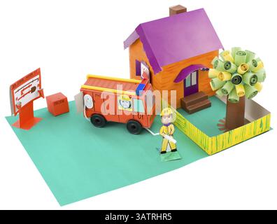 Cardboard handicraft - a fire brigade extinguishes the fire in a house ...
