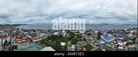 Aerial view over Surigao City looking towards Nonoc and Dinagat Islands ...
