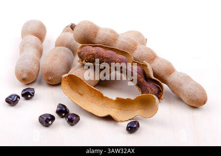 Tamarind. Tropical Fruits. On a wooden background. Top view. Copy space ...