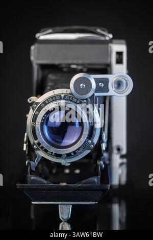 The vintage camera is displayed prominently against a clean background ...