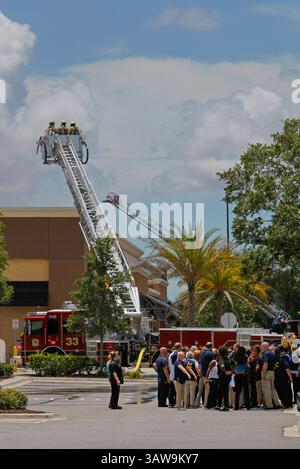 Firefighters battle a fire after an explosion in an industrial area in ...