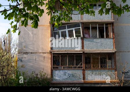 A residential building is seen damaged after a Russian strike in Kyiv ...