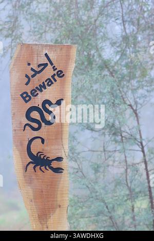 Warning sign of snakes and scorpions in grassland Stock Photo - Alamy