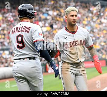 Cleveland Guardians shortstop Brayan Rocchio (4) and left fielder ...
