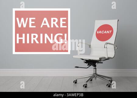 We're hiring. Empty office chair with word Vacant in room. Recruitment ...