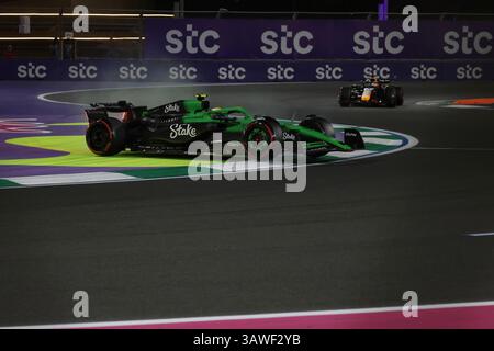 Kick Sauber's Gabriel Bortoleto car is lifted up after crashing during ...