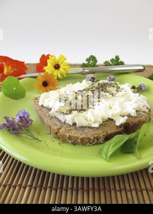 Bread with spice blossom herb quark Stock Photo - Alamy