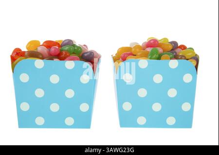 Two blue dotted cartons full with colourful candy Stock Photo - Alamy