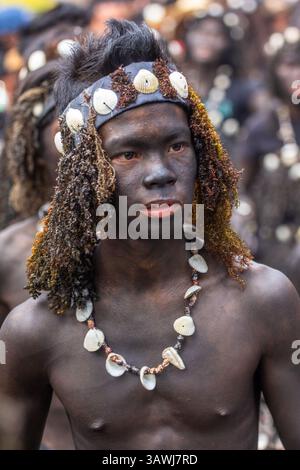 Young Ati-Ati Festival dancers painted black and wearing shell ornament ...