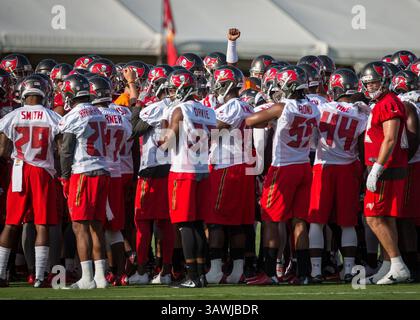 The Tampa Bay Buccaneers huddle up during an NFL football game against ...