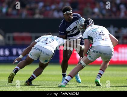 Bristol Bears' Kalaveti Ravouvou (centre) is tackled by Section Paloise ...