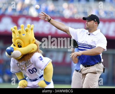 Missouri Head football coach Barry Odom throws a ceremonial first pitch ...