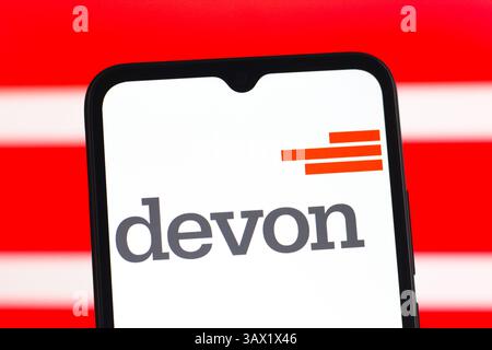 In this photo illustration, the Devon Energy logo is displayed on a ...