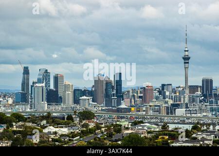 Auckland's skyline showcases tall buildings with the iconic Sky Tower ...