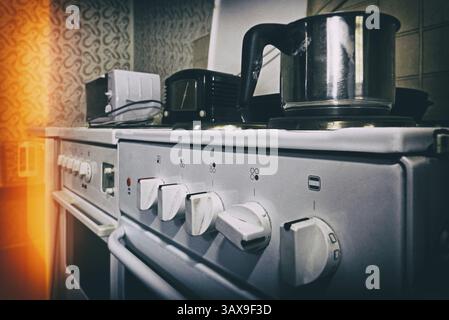 Old electric cooker and empty pot Stock Photo - Alamy