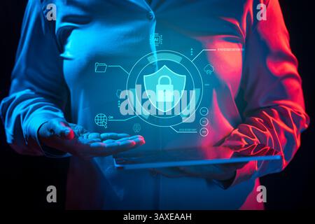 Holding futuristic tablet, security concept Stock Photo - Alamy