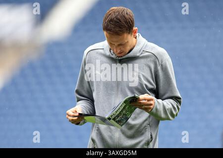 Derby County's Craig Forsyth reads the match day programme before the ...
