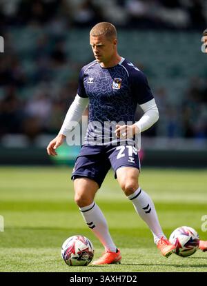 Coventry City's Jake Bidwell warms up ahead of the pre-season friendly ...