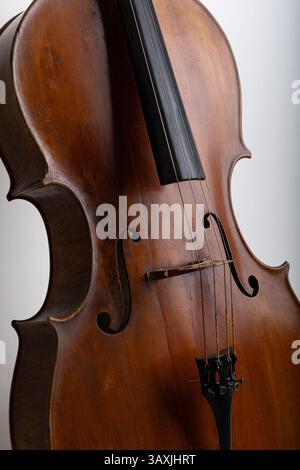 Cello concert with instrument close up. Red vibrant background at rock ...