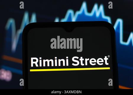 In this photo illustration the Rimini Street logo seen displayed on a ...