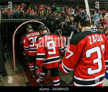 New Jersey Devils' Taylor Hall celebrates with teammates on the bench ...